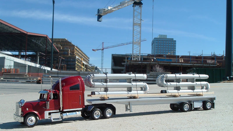 Freightliner Classic XL & Flatbed With Pipe Load